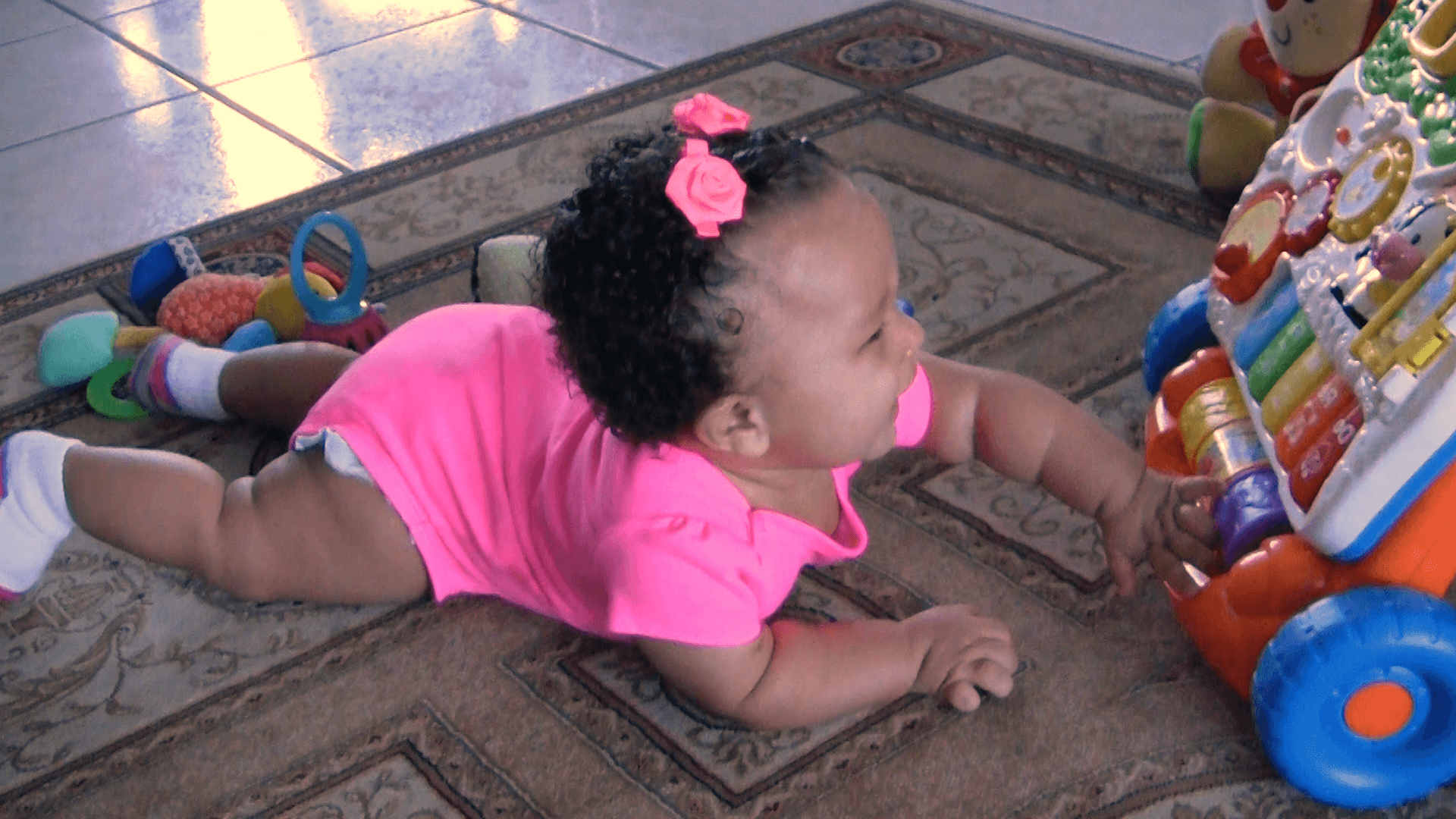 Pathways.org | Reaches for toys while on tummy