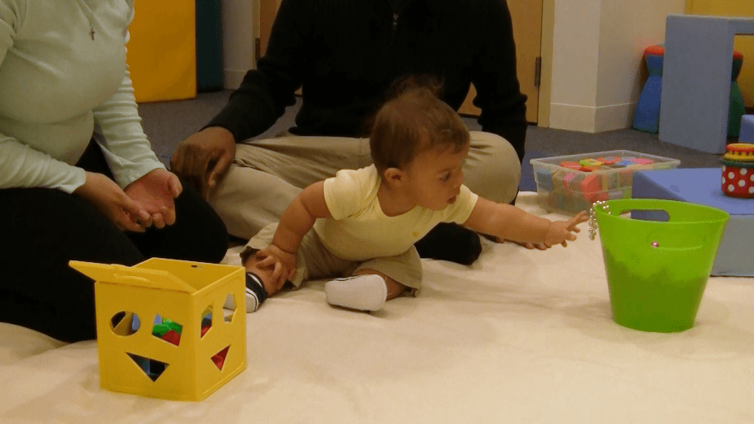 Pathways.org | Sits and reaches for toys without falling